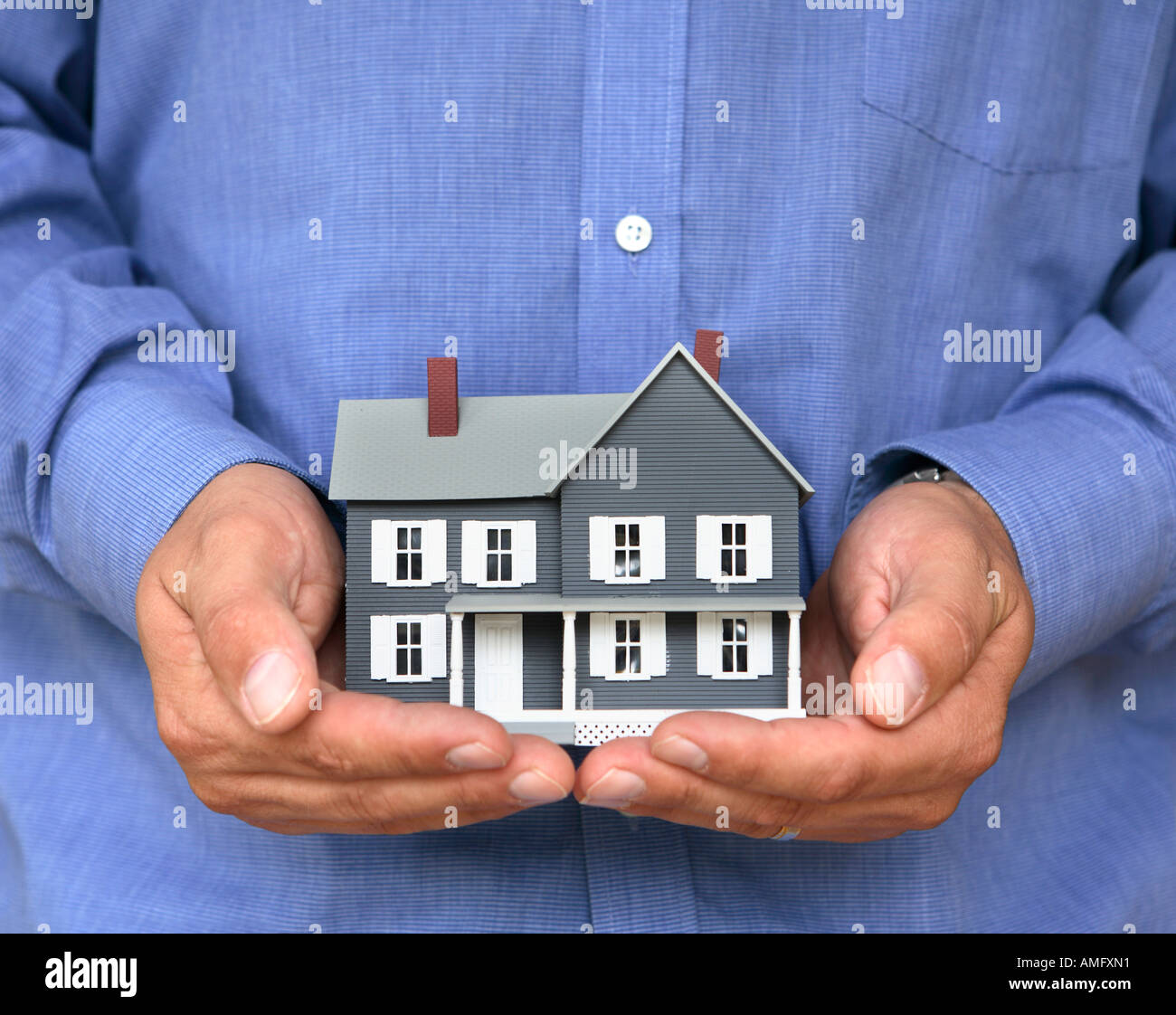 Hands Holding Small House Stock Photo - Alamy