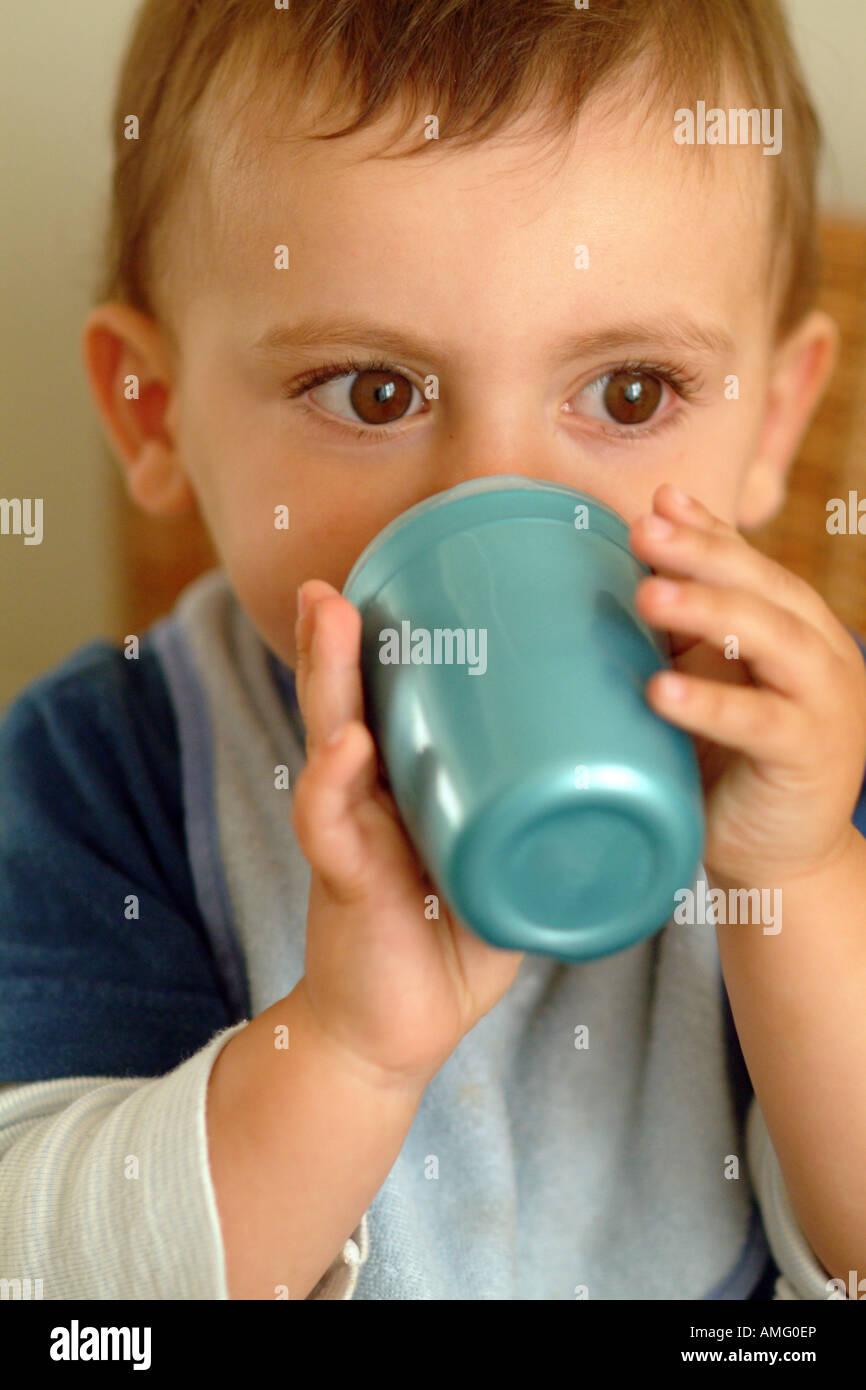 Happy baby drinking from a cup Stock Photo - Alamy