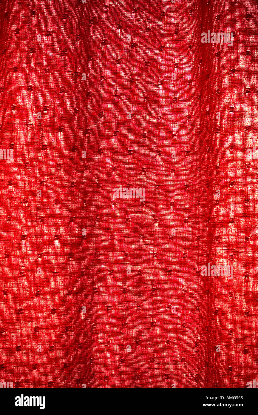 red textured curtain backlit by sun Stock Photo - Alamy