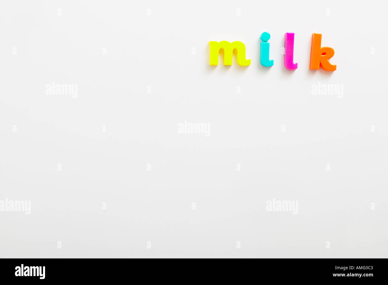 kids alphabet fridge magnets spelling milk Stock Photo - Alamy