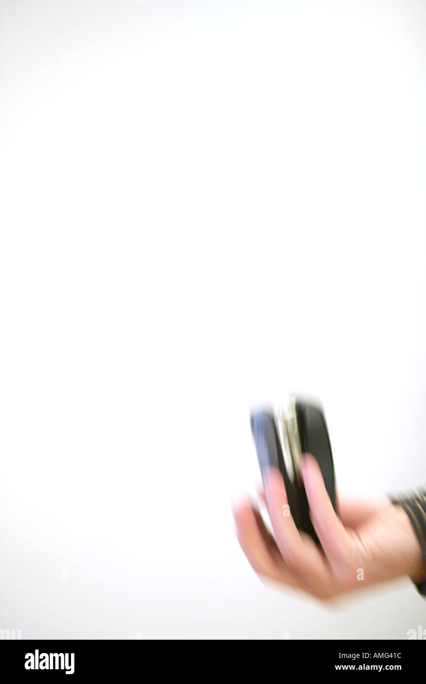 Mans hand catching falling office stapler Stock Photo - Alamy