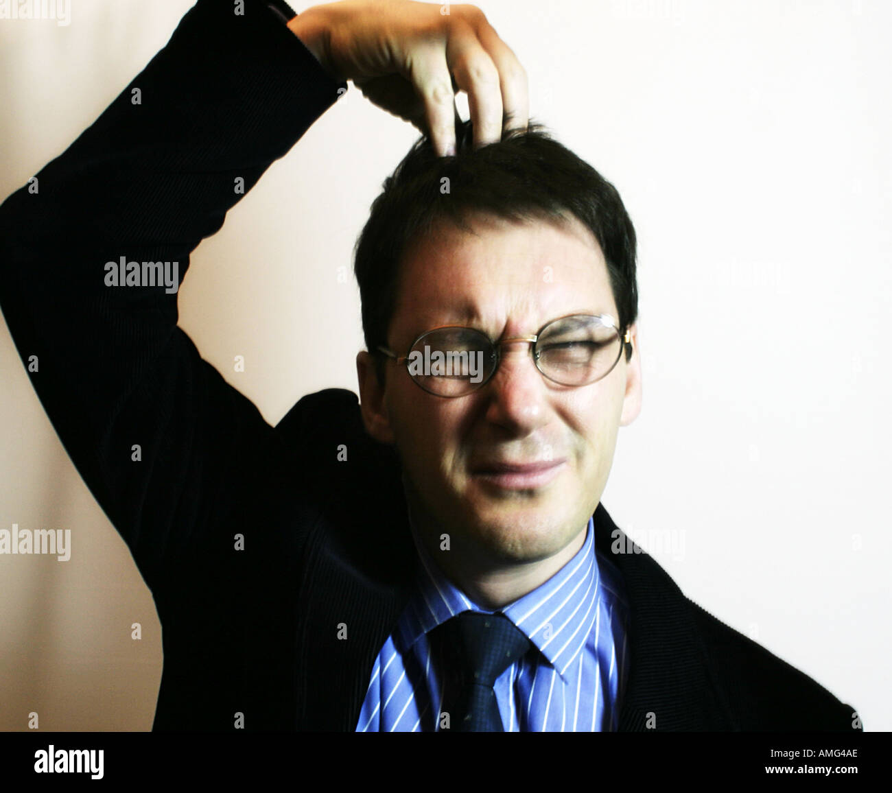 Confused business man Stock Photo - Alamy