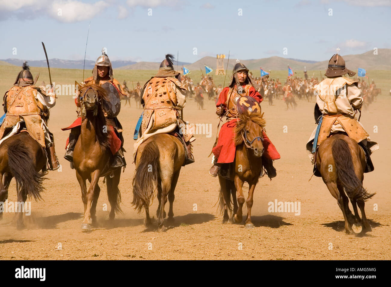 Mongolian horsemen with swords Stock Photo - Alamy