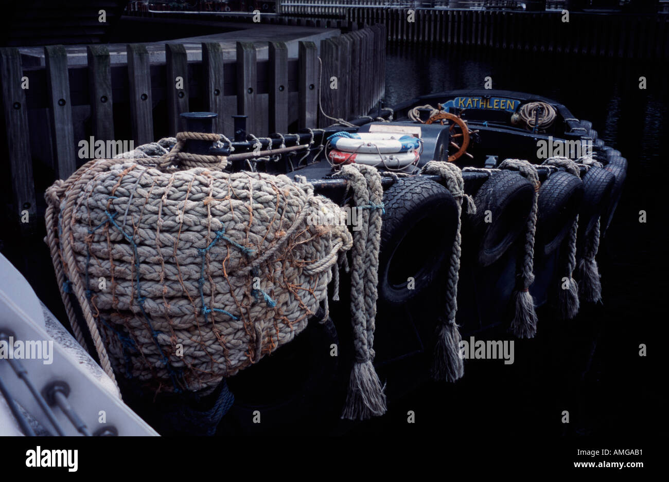 Boat with ropes hanging down side West India Dock London, England UK ...