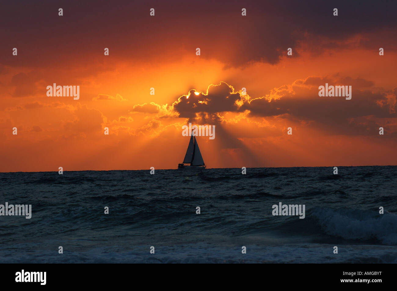 Mediterranean Sun Set A sail boat crossing the sun A sequence of 4 ...