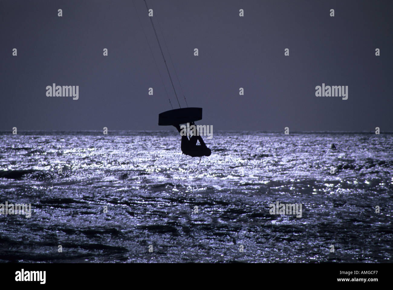 Big wave surfer jump air blue hi-res stock photography and images - Alamy