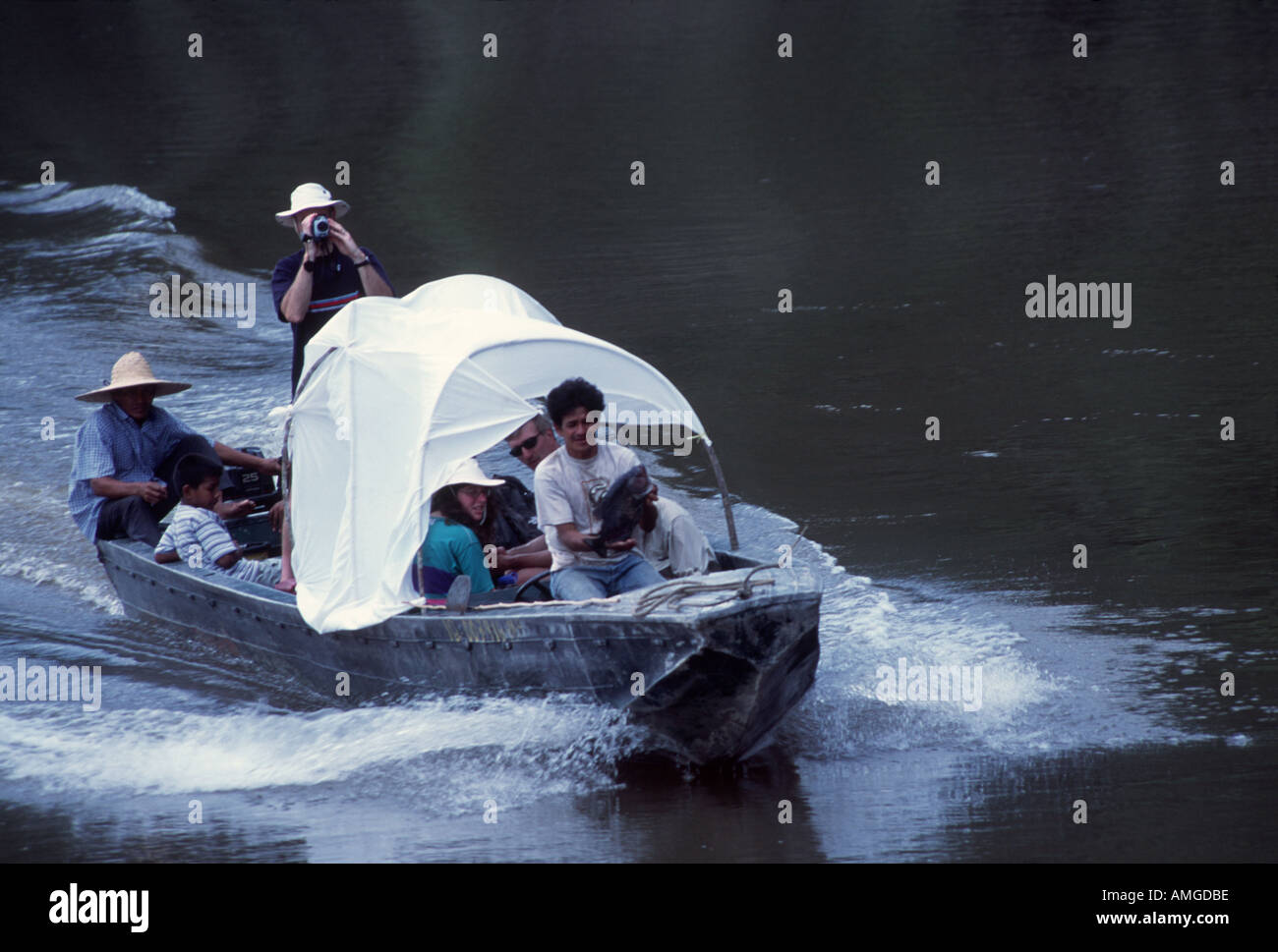 Amazon tourists in runabout coming back from jungle excursion Stock ...