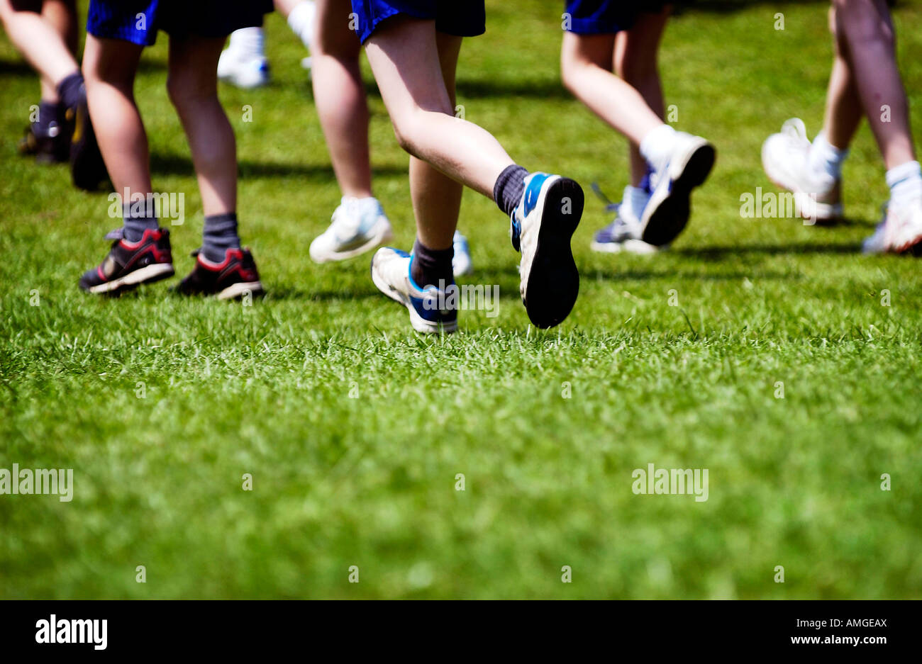Kids feet running on grass hi-res stock photography and images - Alamy