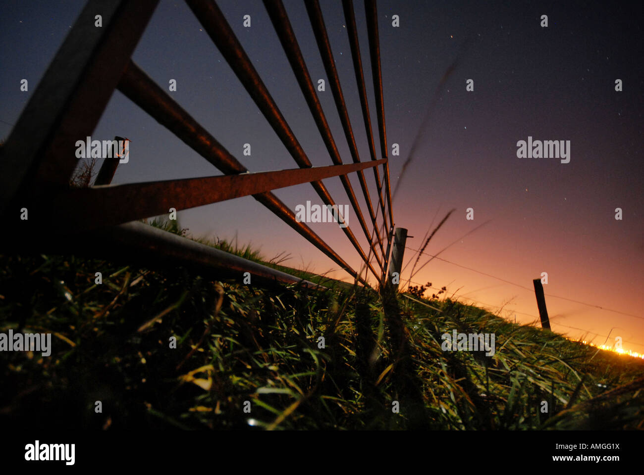 gate in a field at night Stock Photo - Alamy