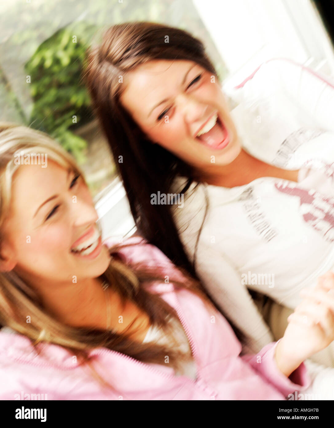 Two girls giggling hi-res stock photography and images - Alamy