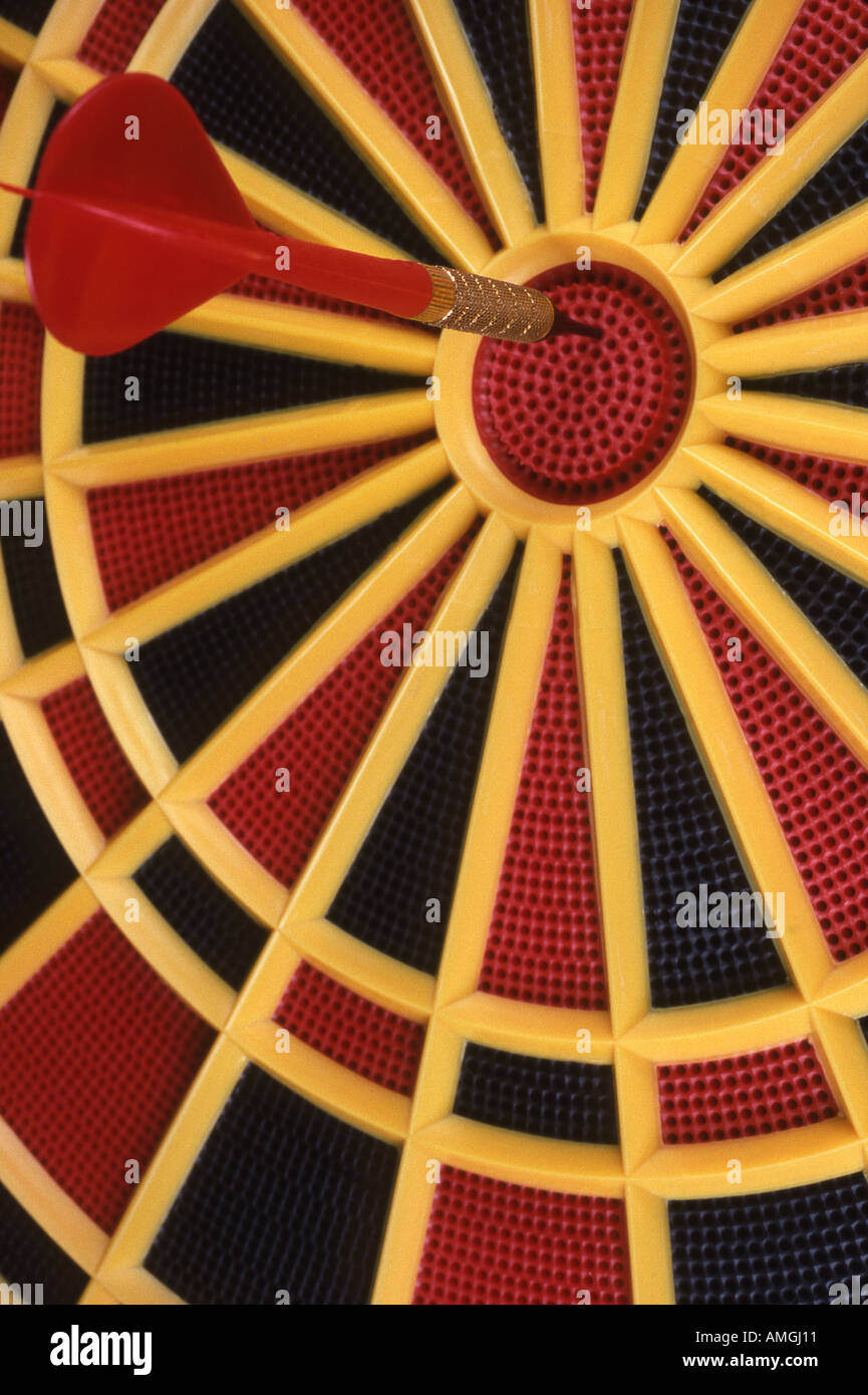Red Dart and Dart Board close up Stock Photo - Alamy