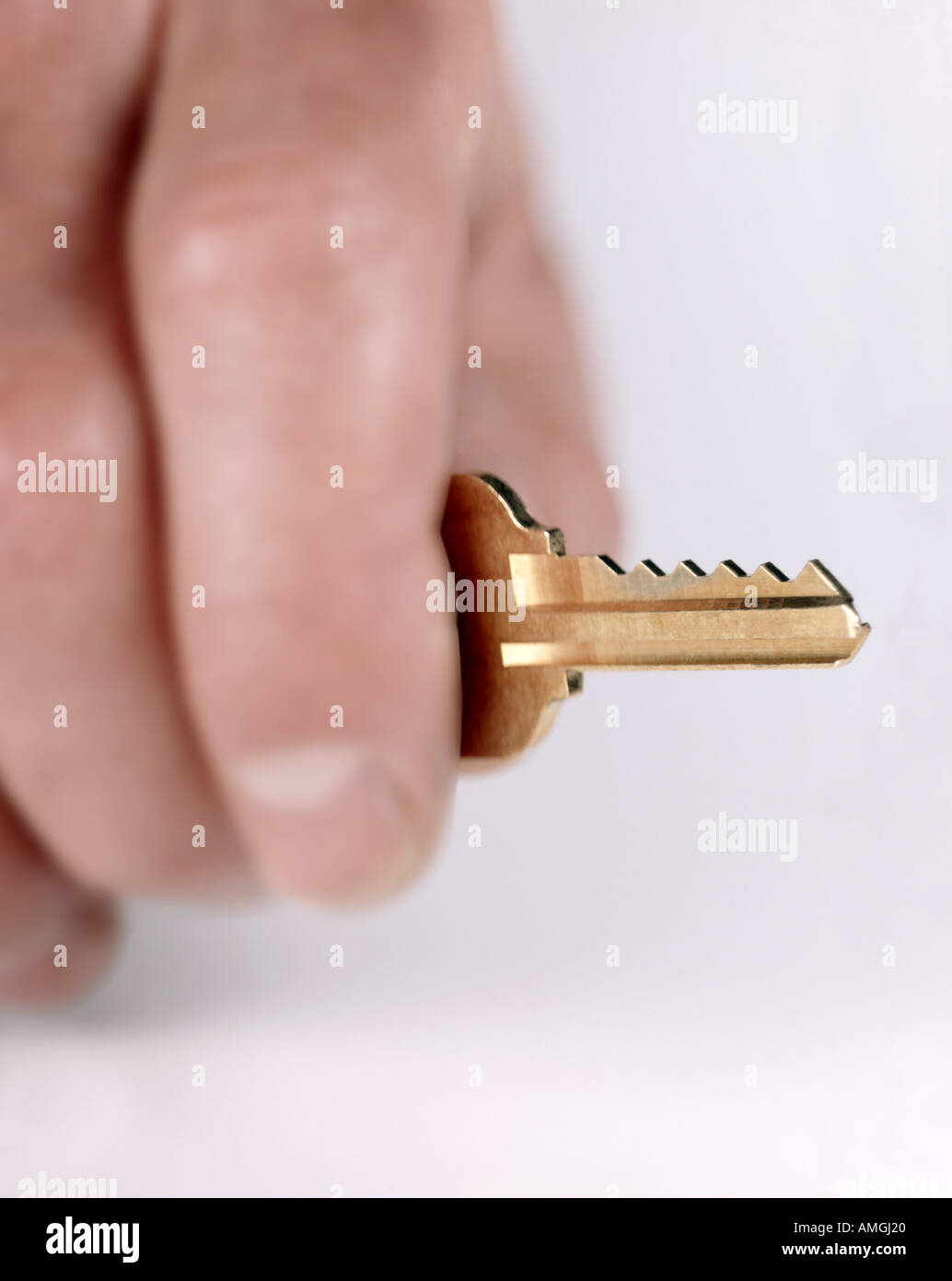 Hand holding brass lock hi-res stock photography and images - Alamy