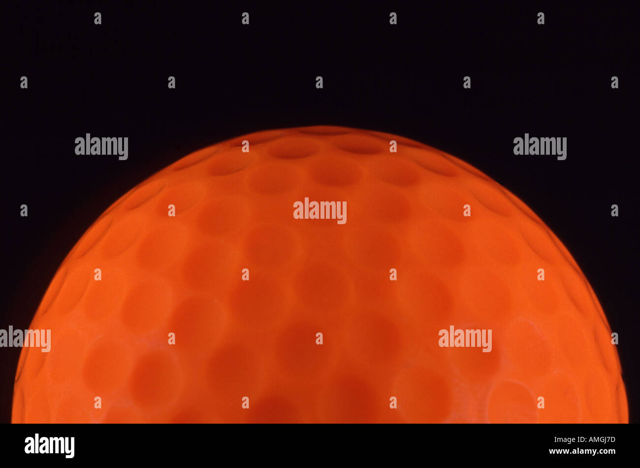 Orange golf ball close up Stock Photo - Alamy