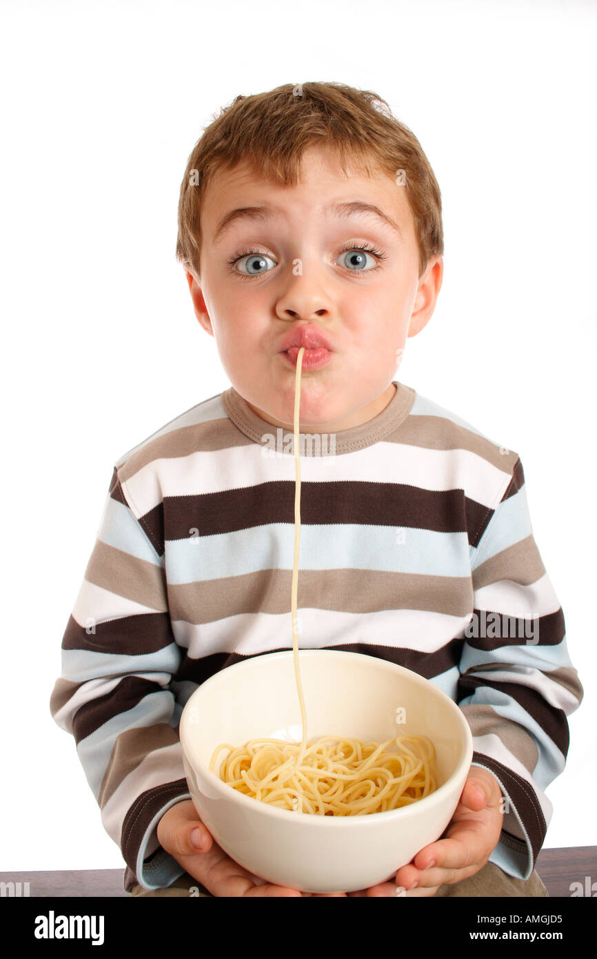 Little boy sucking spaghetti from a bowl Stock Photo - Alamy