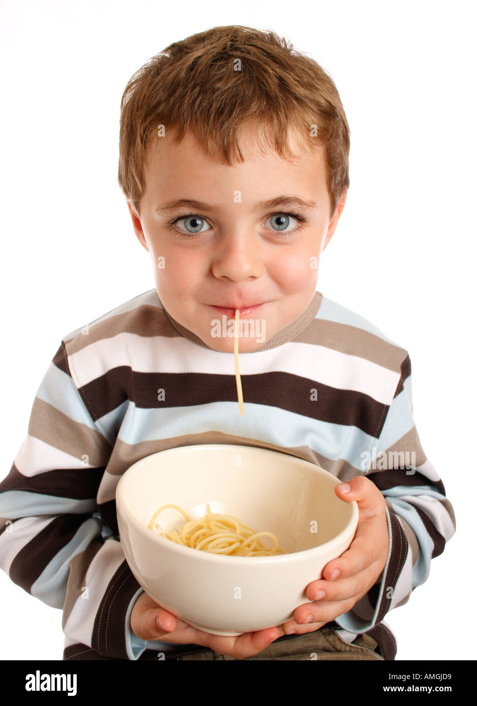 Little boy eating spaghetti from a bowl Stock Photo - Alamy