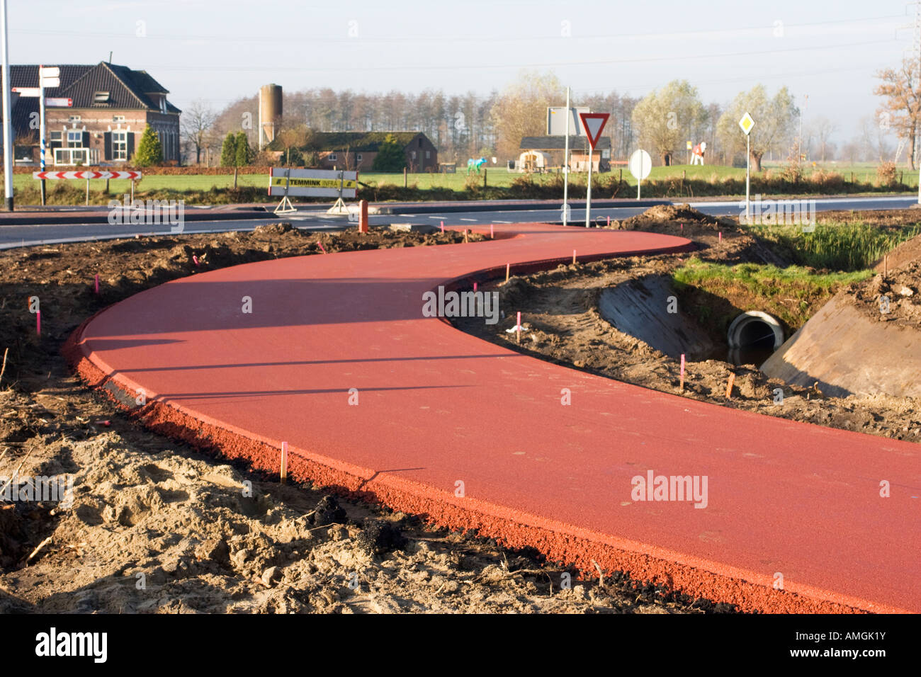 Bicycle path with red tarmac Stock Photo - Alamy