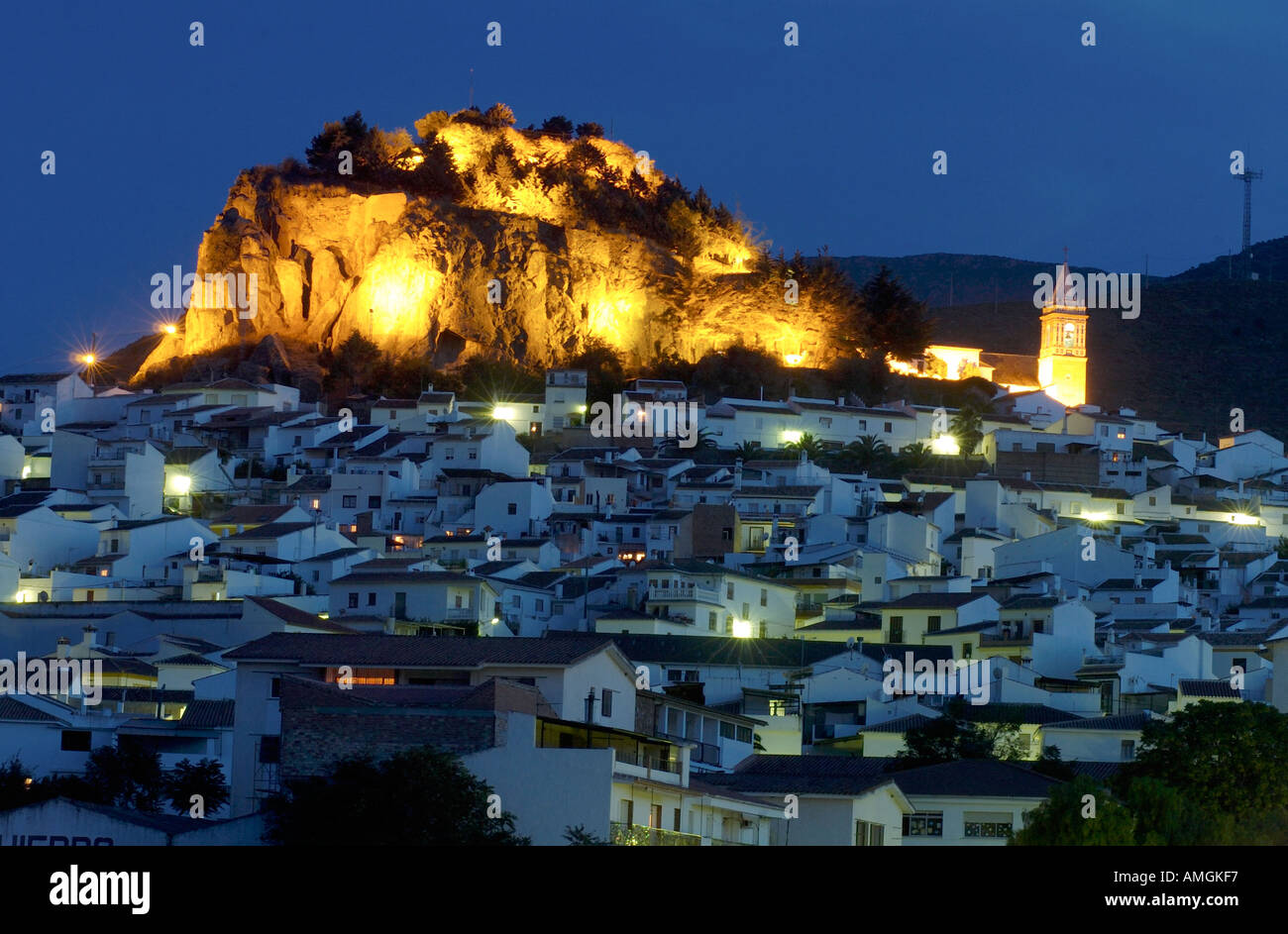 Ardales village at twilight, showing the large Limestone Promontory ...