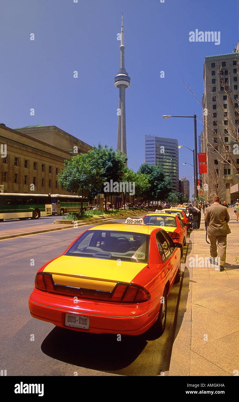 Row of Taxis Parked on Street, With CN Tower in Distance, Toronto ...
