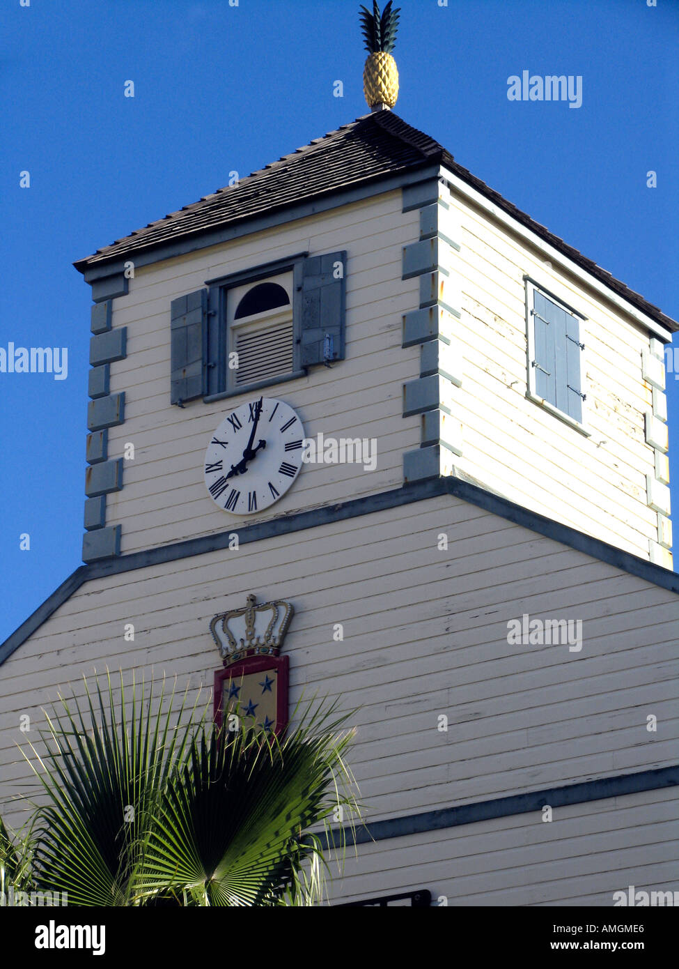 Traditional wooden courthouse topped with a hospitality symbol ...