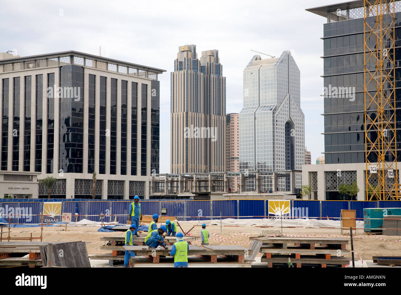 Workmen on site at the unfinished, incomplete skyscraper Buildings ...