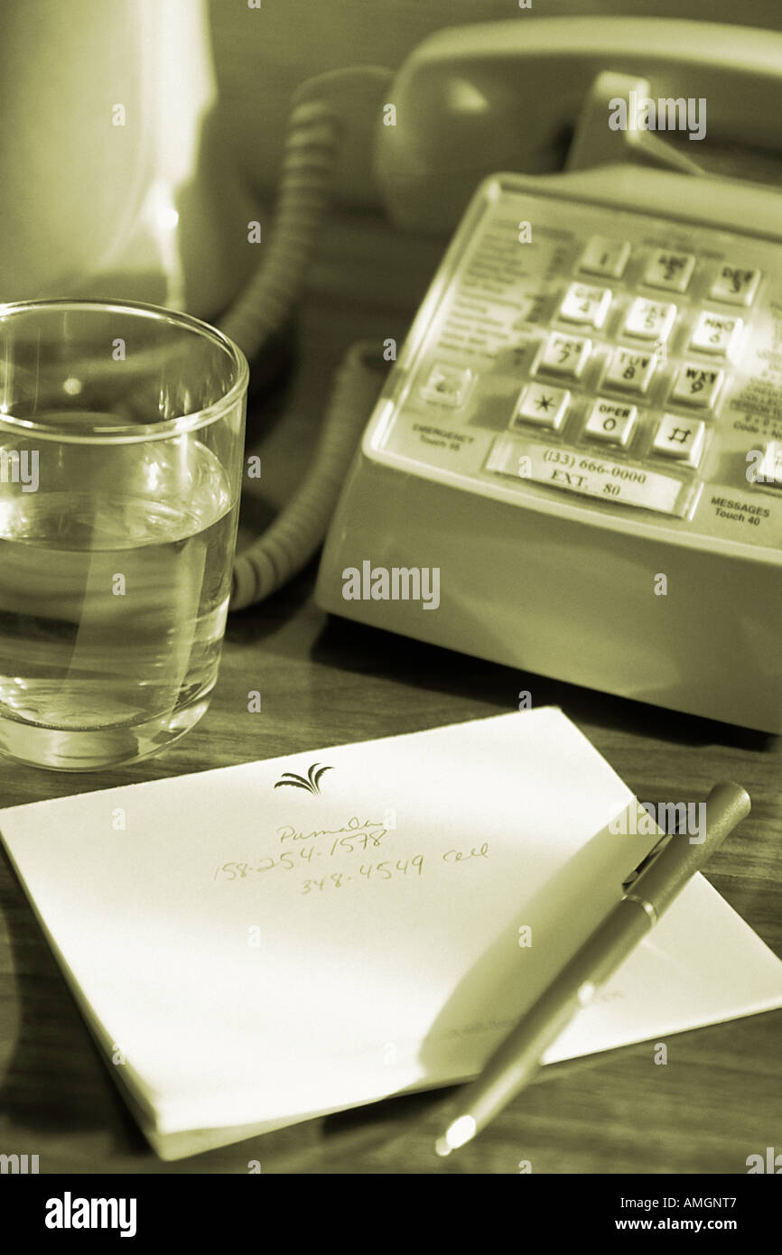 Notepad, Glass of Water and Hotel Room Phone Stock Photo - Alamy