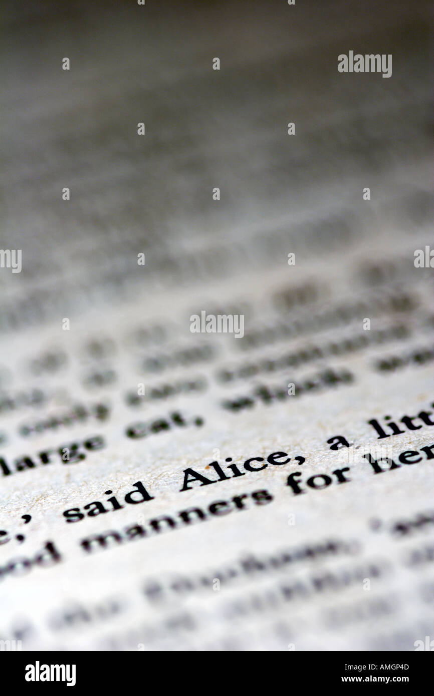 Vertical close up of text words in open book Stock Photo - Alamy
