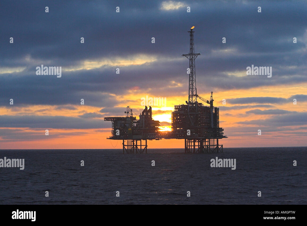 Rig complex at sunset Stock Photo - Alamy