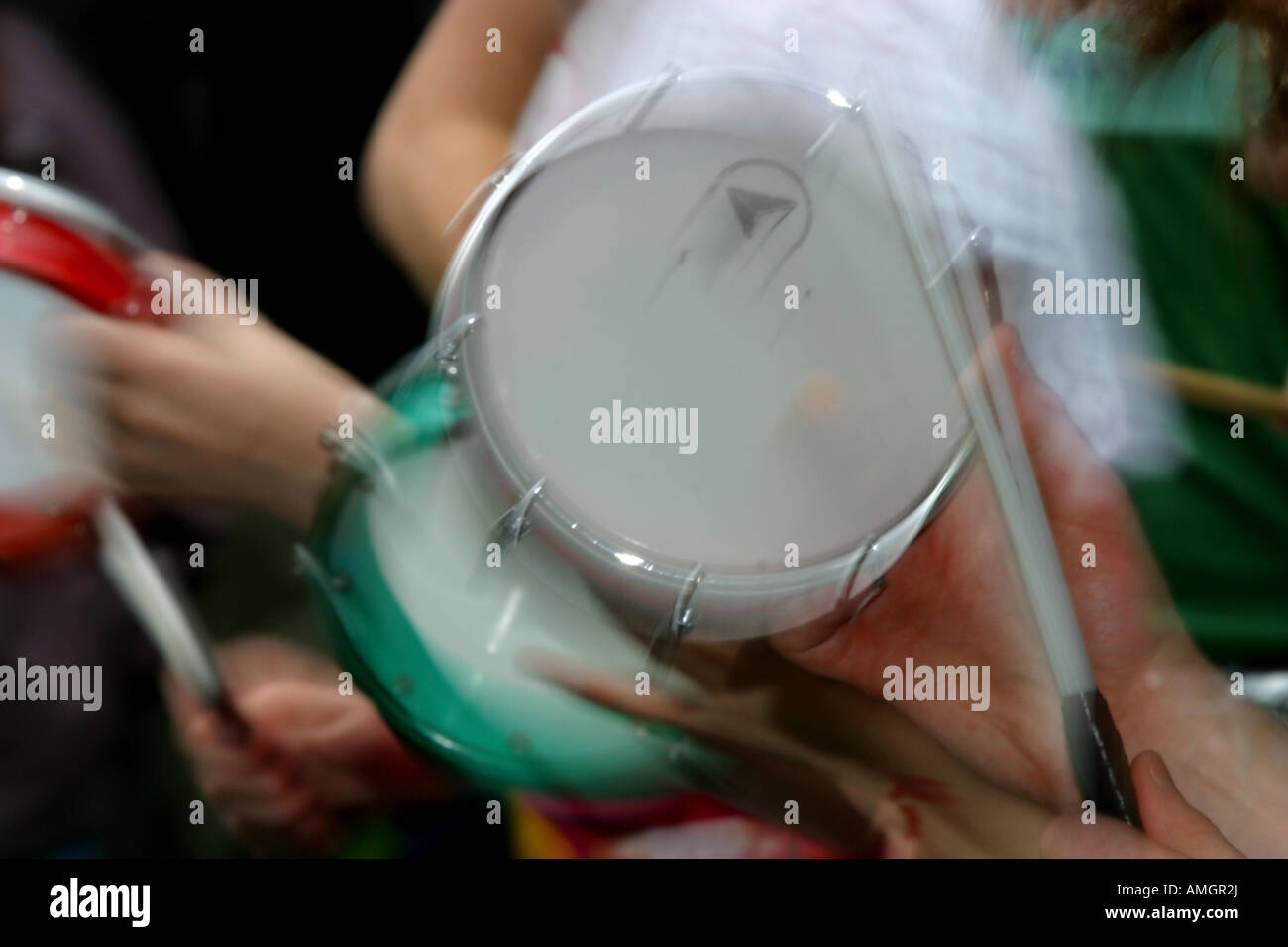 Tambourines shaking with drumsticks Stock Photo - Alamy