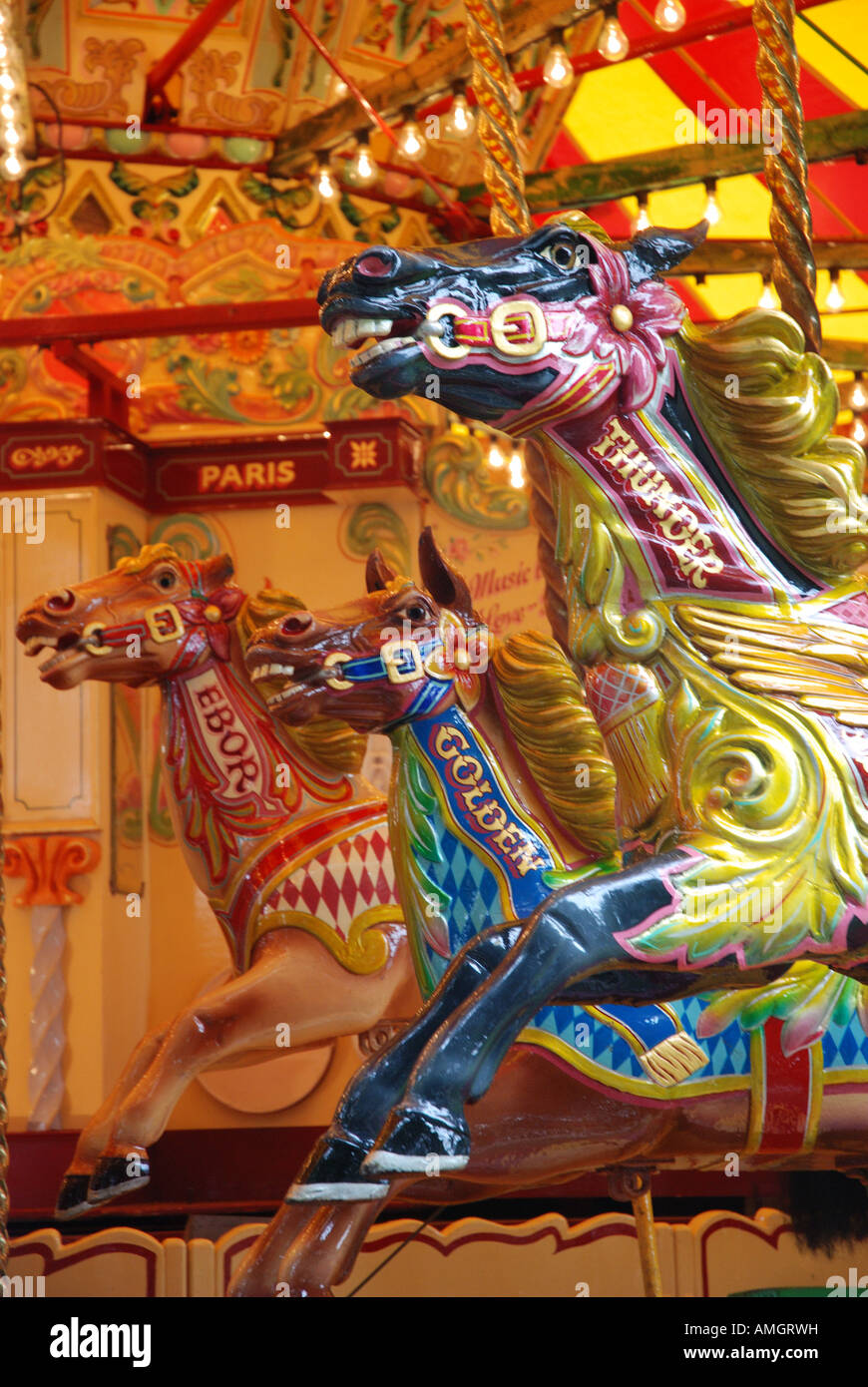 Merry go round holiday fair ground attraction Stock Photo - Alamy