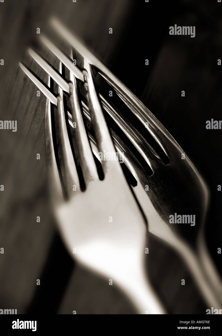 steel table forks meshed together Stock Photo - Alamy