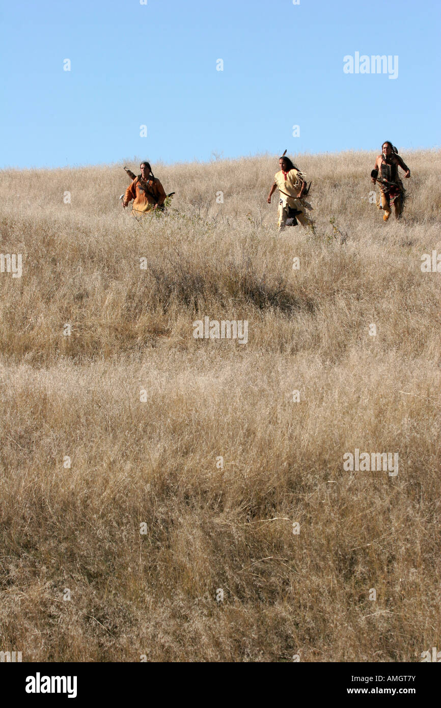 Three Native American Indian men running in the dead grasses Stock ...