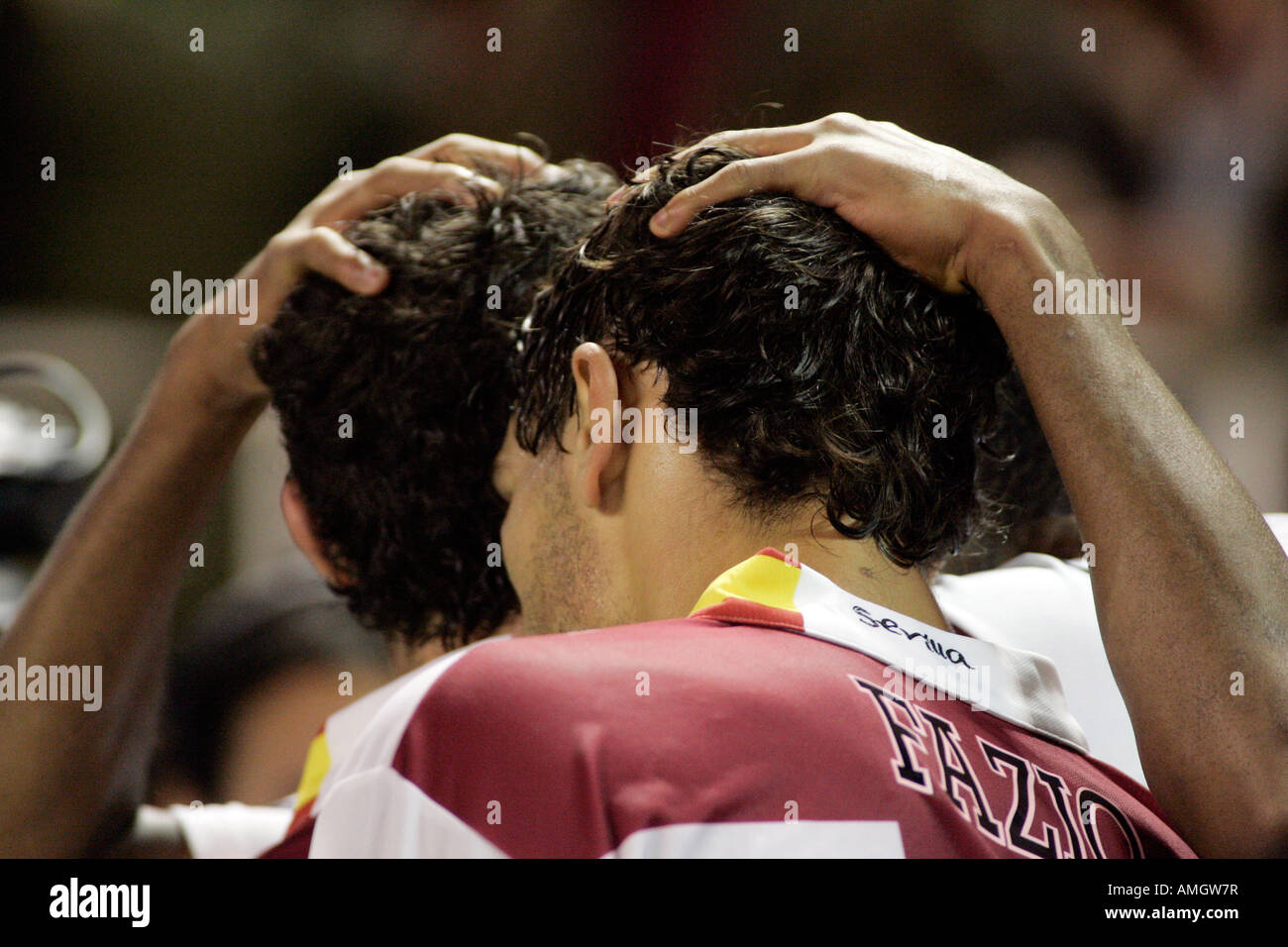 Heads and arms of Sevilla FC players hugging after a goal scoring Stock ...