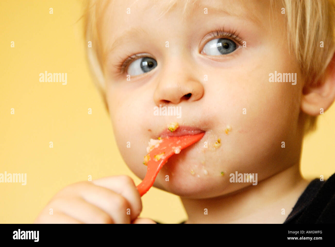 Baby boy eating Stock Photo - Alamy