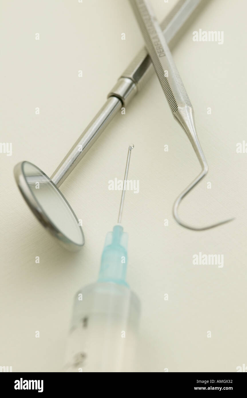A needle and dental objects Stock Photo - Alamy
