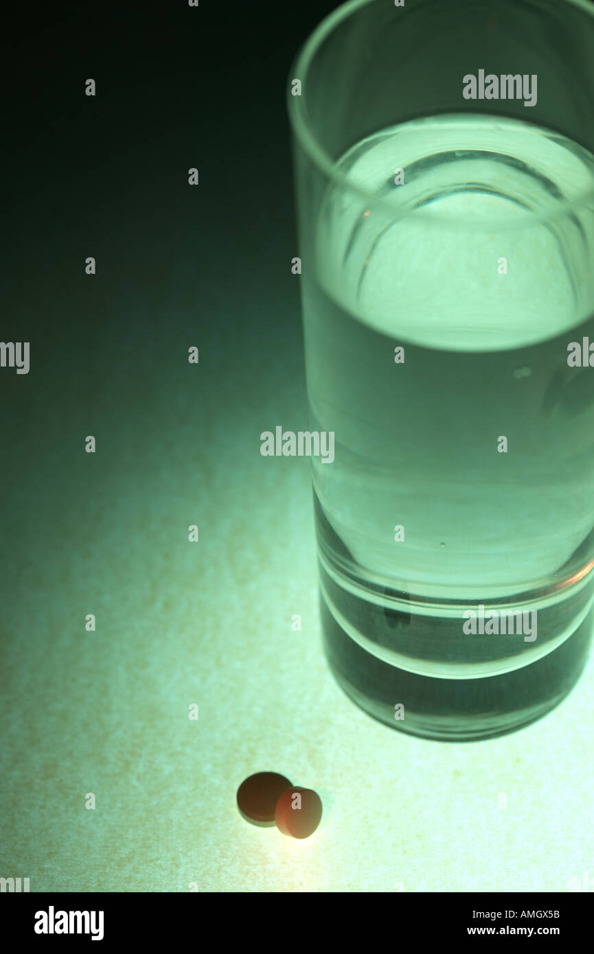 Medicines and water glass Stock Photo - Alamy
