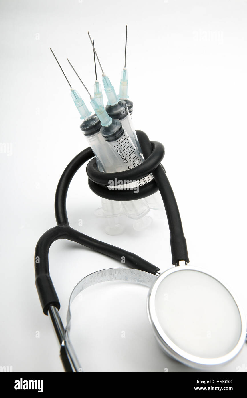 Needles and a stethoscope Stock Photo - Alamy