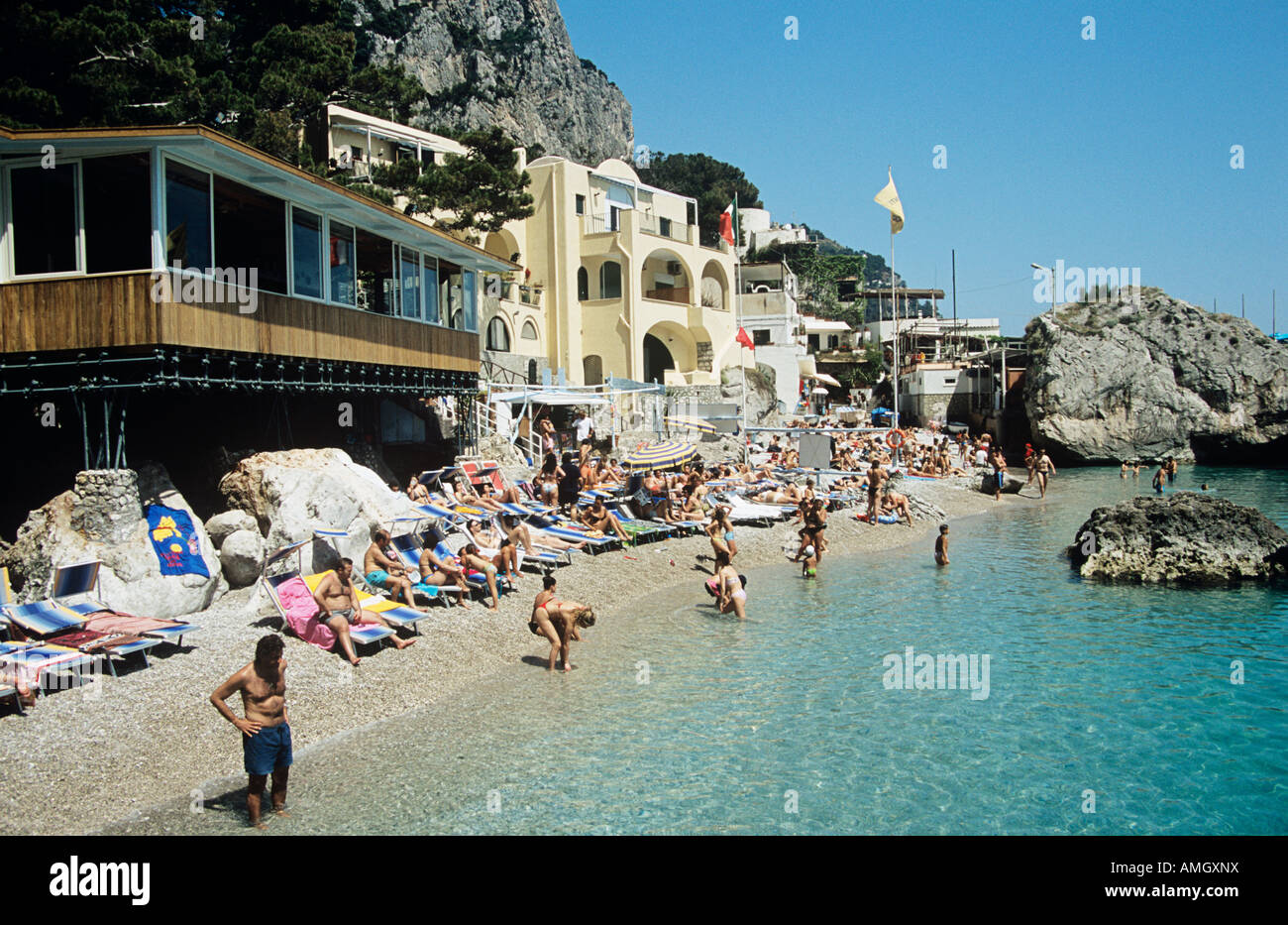 Tourists sunbathing on beach at Marina Piccola, Capri, Italy Stock ...