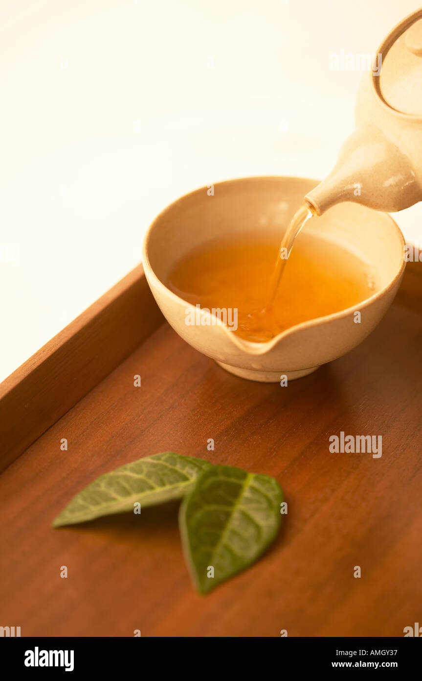 Brown teapot and tea leaves hi-res stock photography and images - Alamy