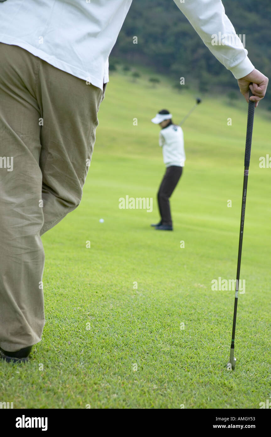 People playing golf Stock Photo - Alamy