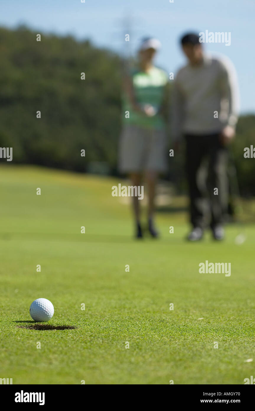 People playing golf Stock Photo - Alamy