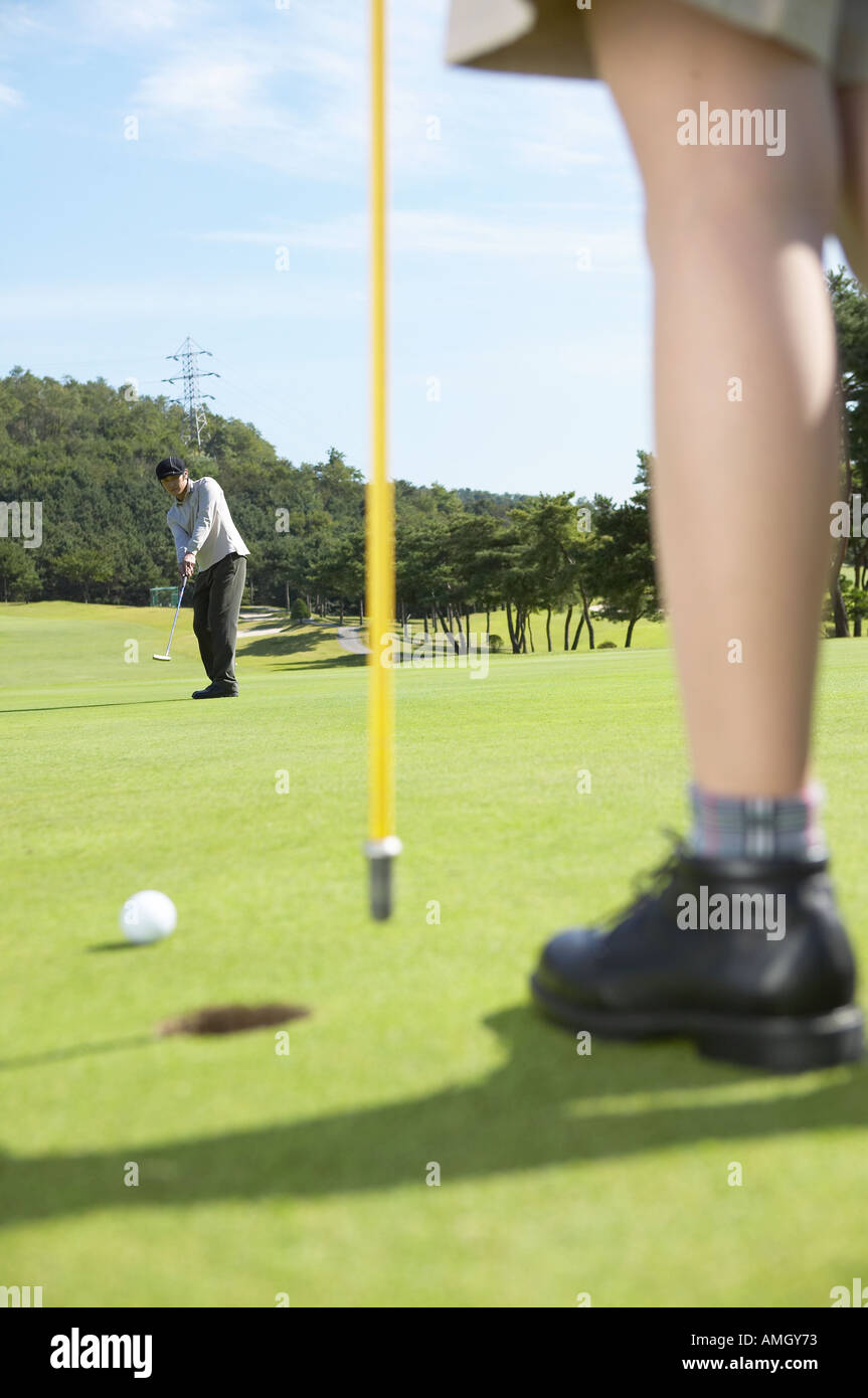 People playing golf Stock Photo - Alamy
