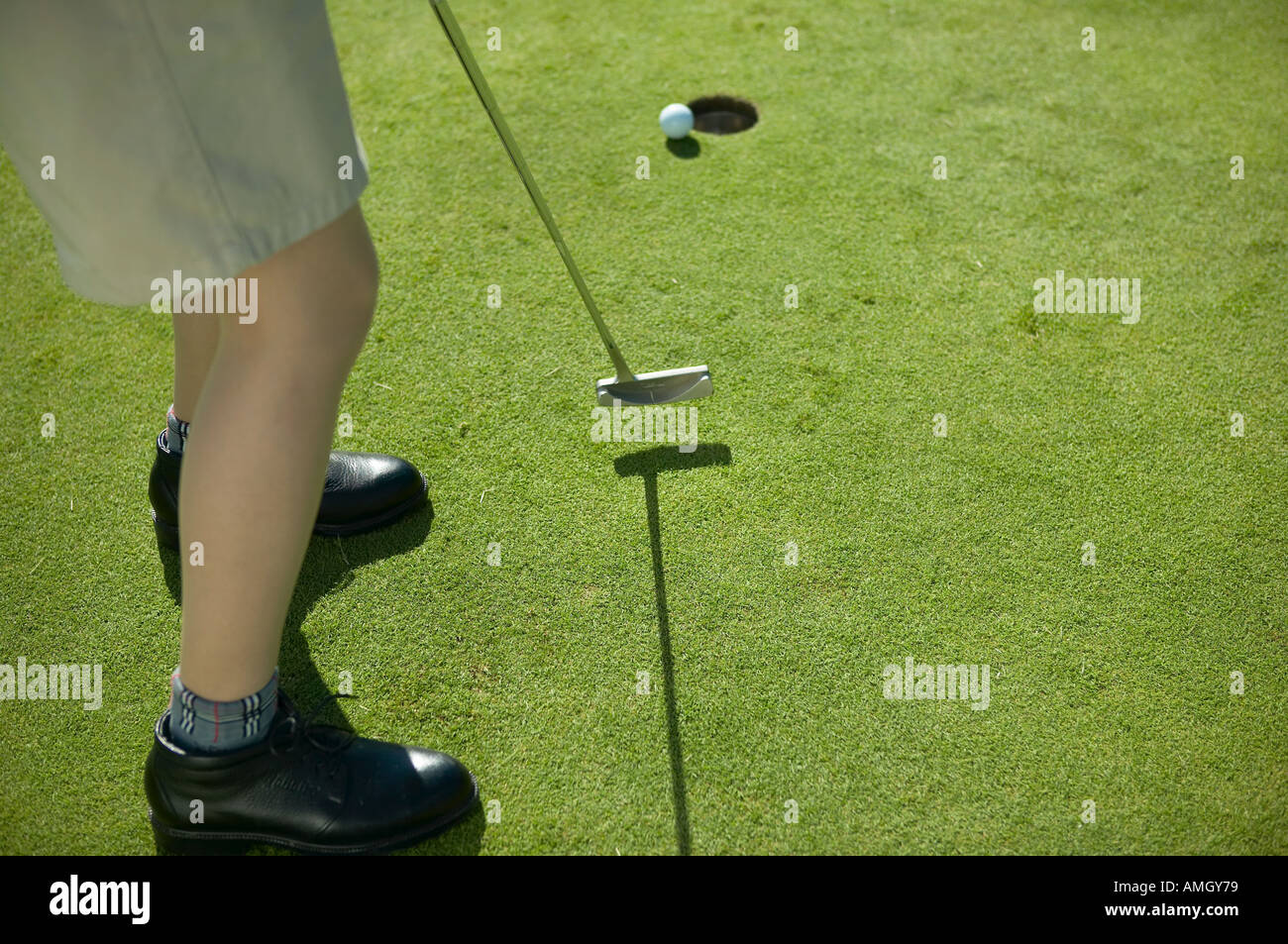 A person playing golf Stock Photo - Alamy