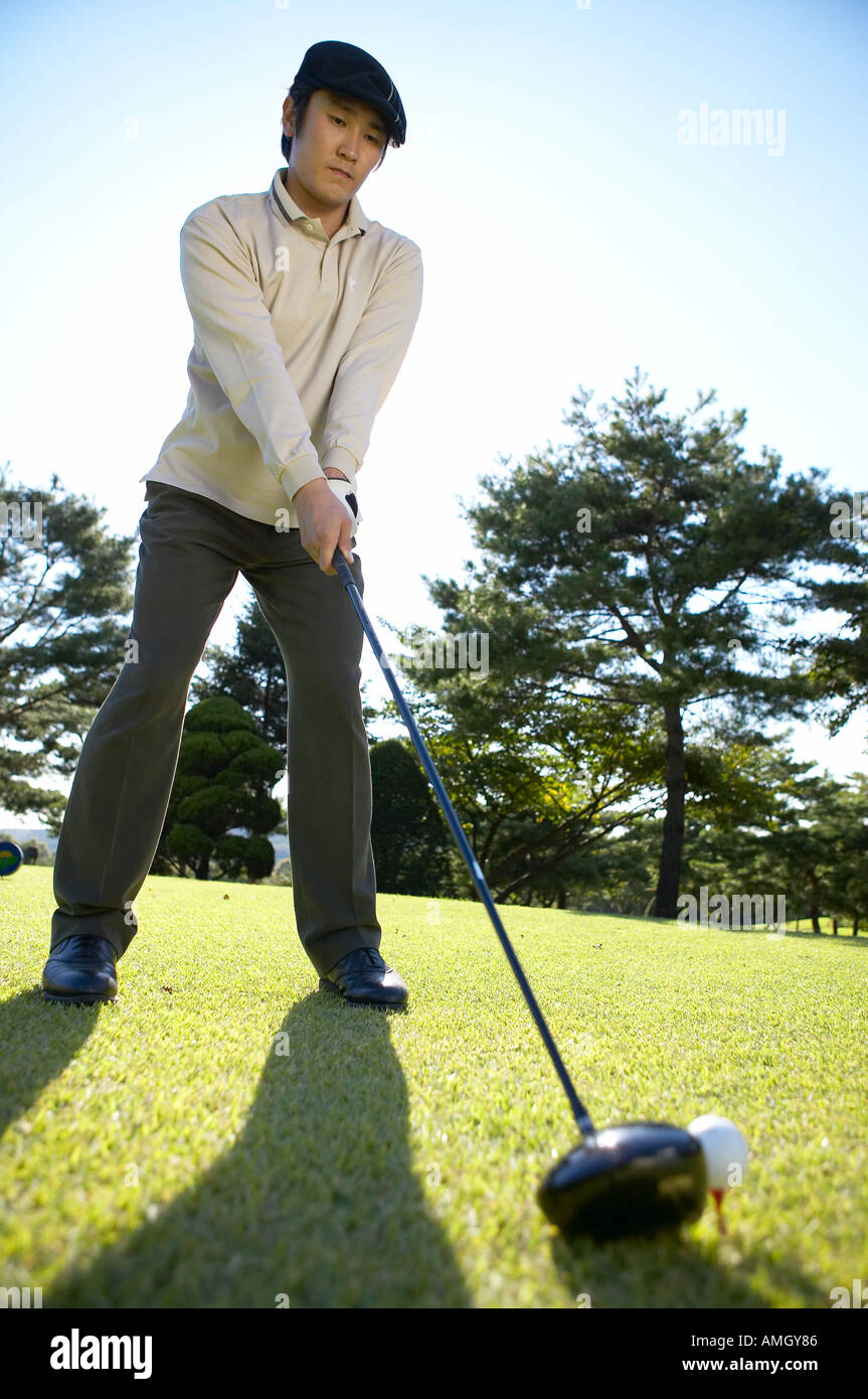 A man playing golf Stock Photo - Alamy
