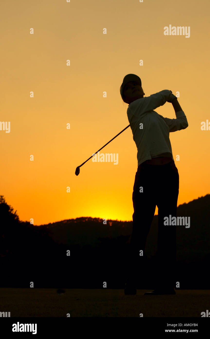 A woman playing golf Stock Photo - Alamy