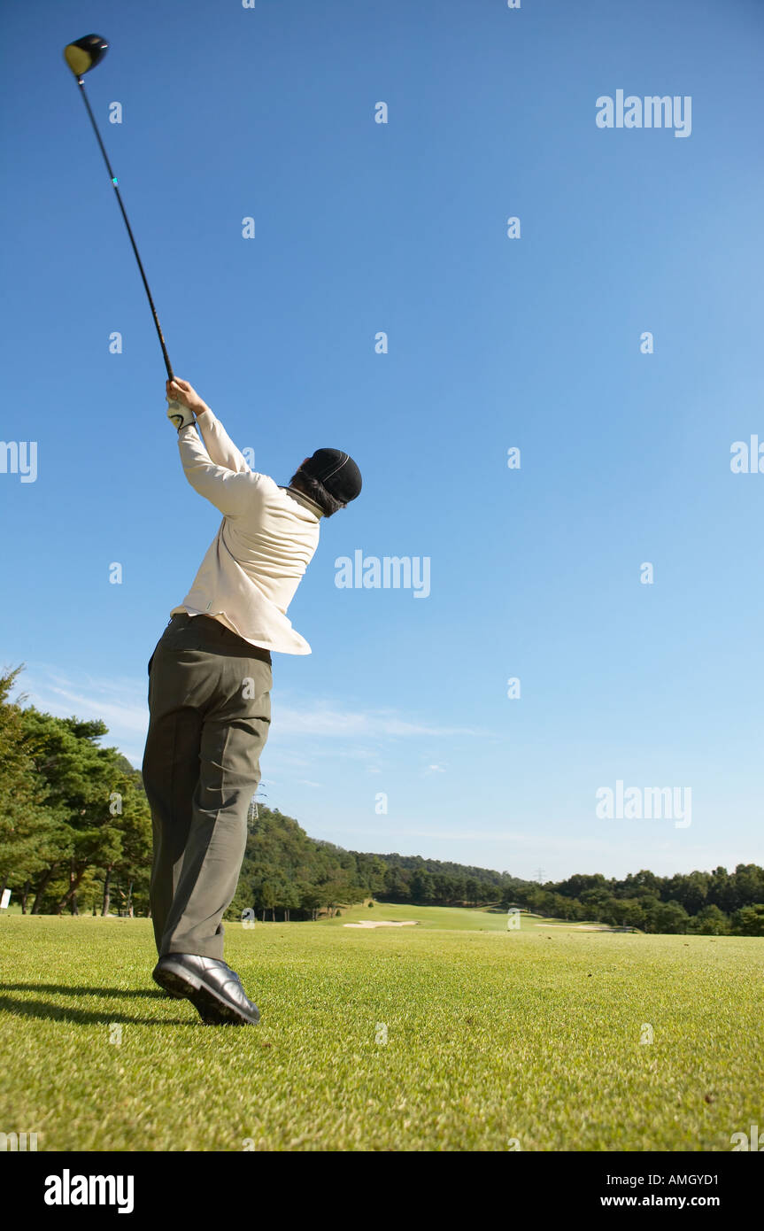 A man playing golf Stock Photo - Alamy