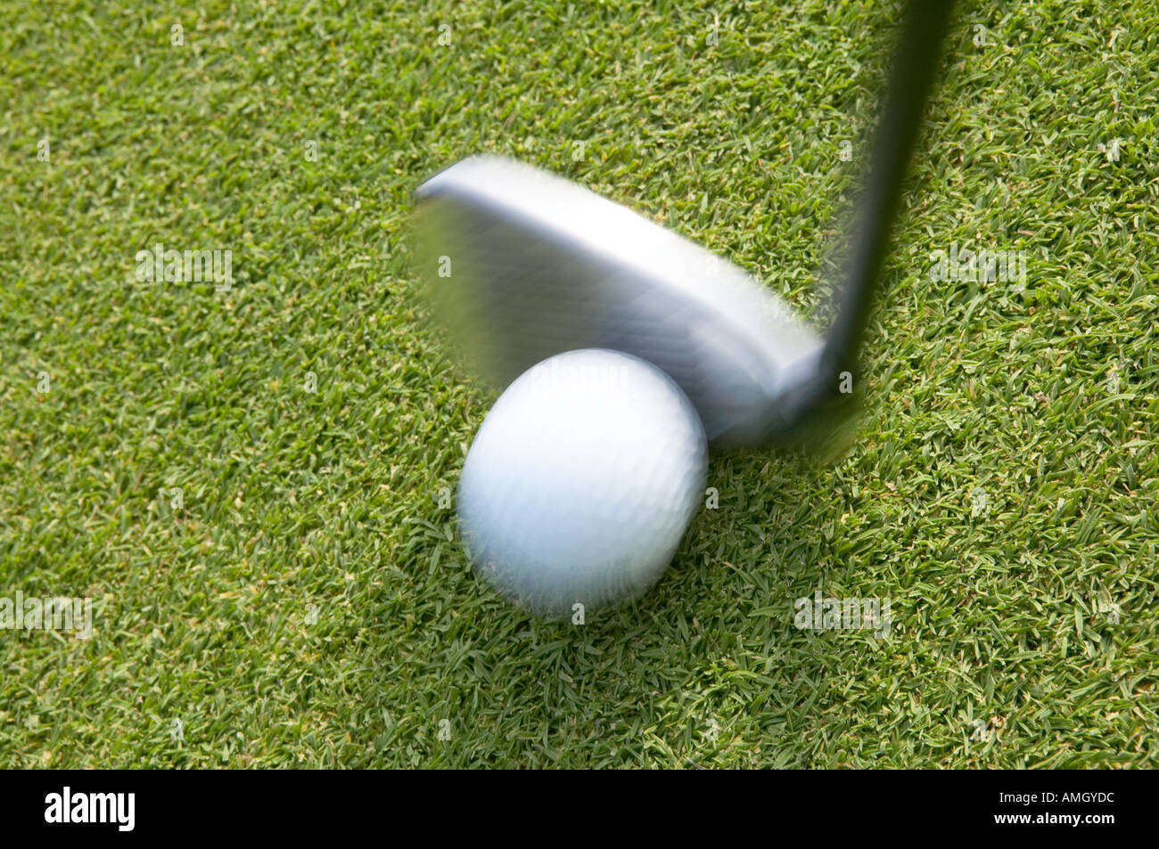 A golf club hitting a golf ball Stock Photo - Alamy