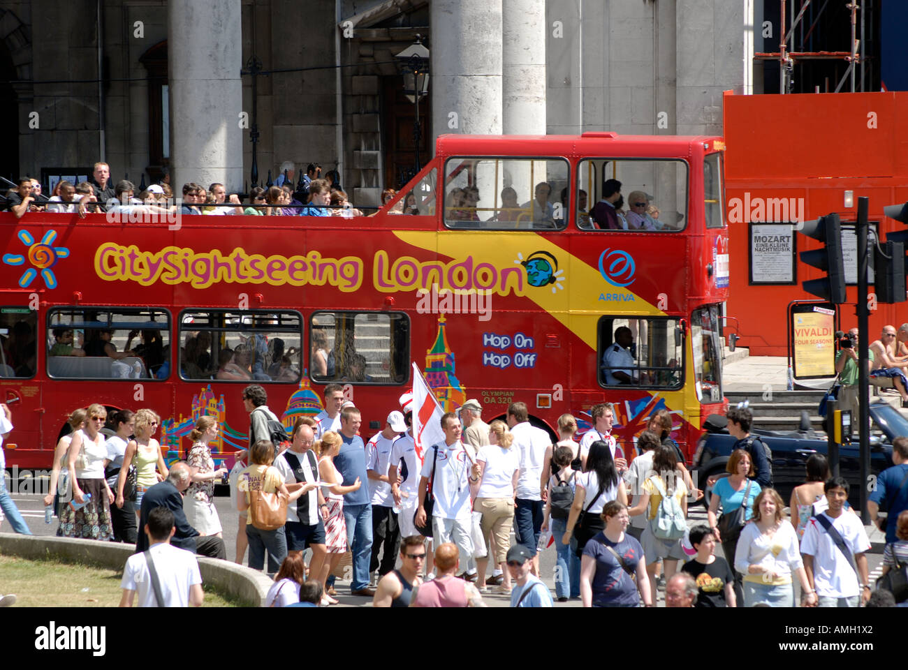 Open tourist bus in Trafalgar Square London Stock Photo - Alamy