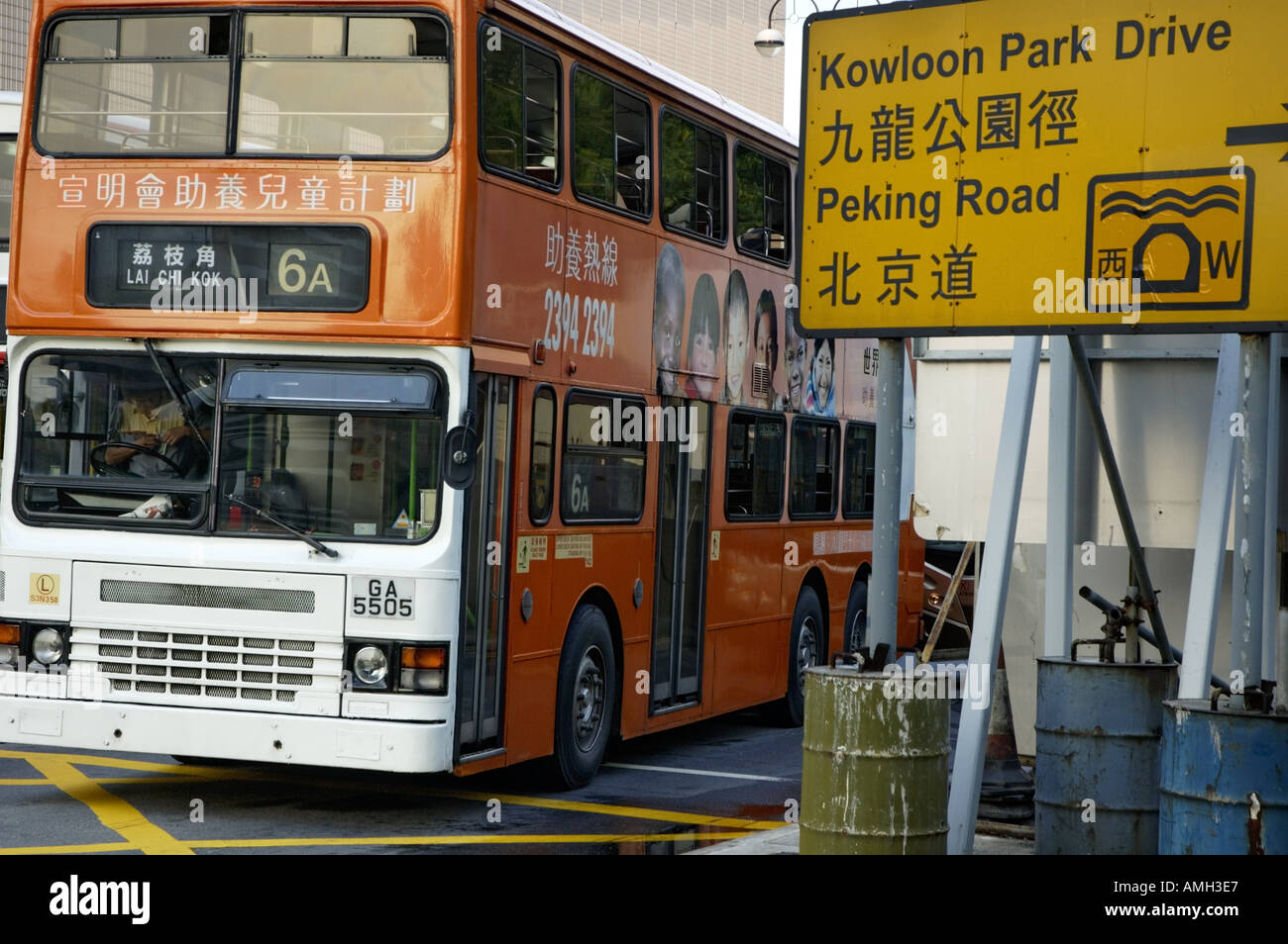 China Hong Kong Kowloon Double Dutch Buses Bus And A Road Sign On ...