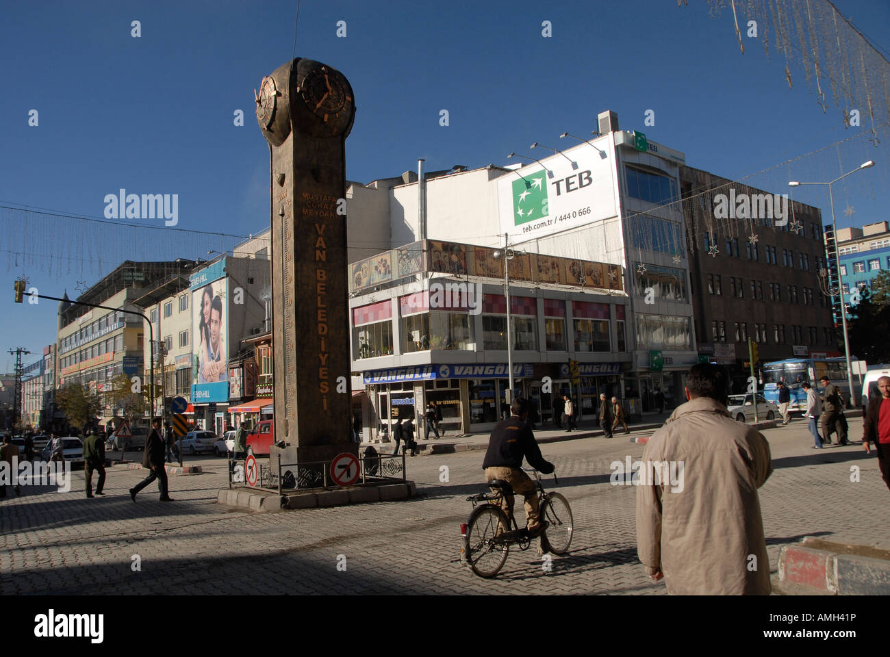 Kurdish civilians pass by the main square of Van city, Eastern Turkey ...