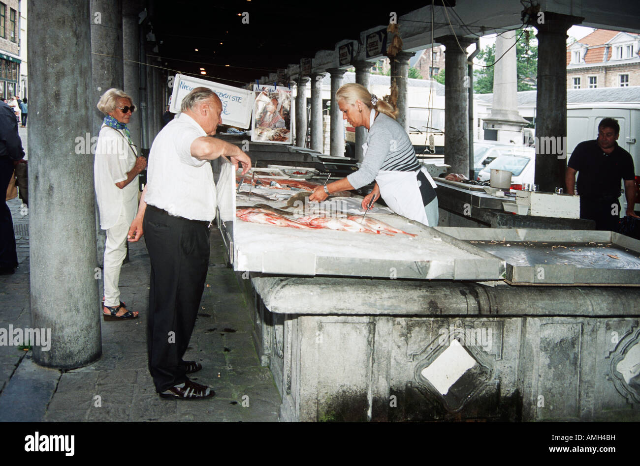 People buying fish in a market, Bruges, Belgium Stock Photo - Alamy